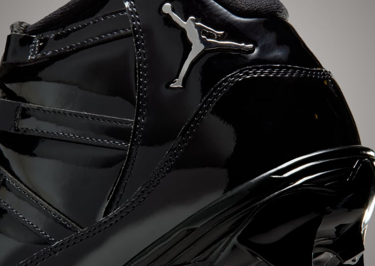 Jordan adds Triple Black Patent Leather to Jordan 11 Football Cleats
