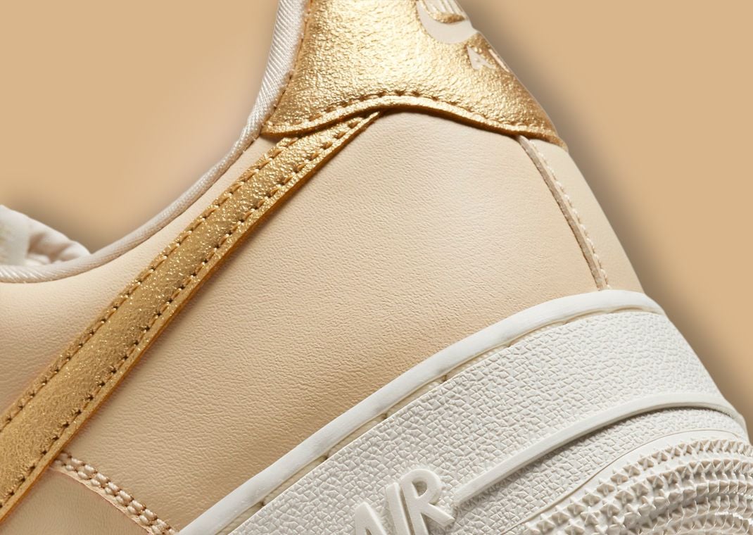 Luxe Metallic Gold Swooshes Adorn The Nike Air Force 1 Low Luxe Metallic Gold Swooshes Adorn The Nike Air Force 1 Low